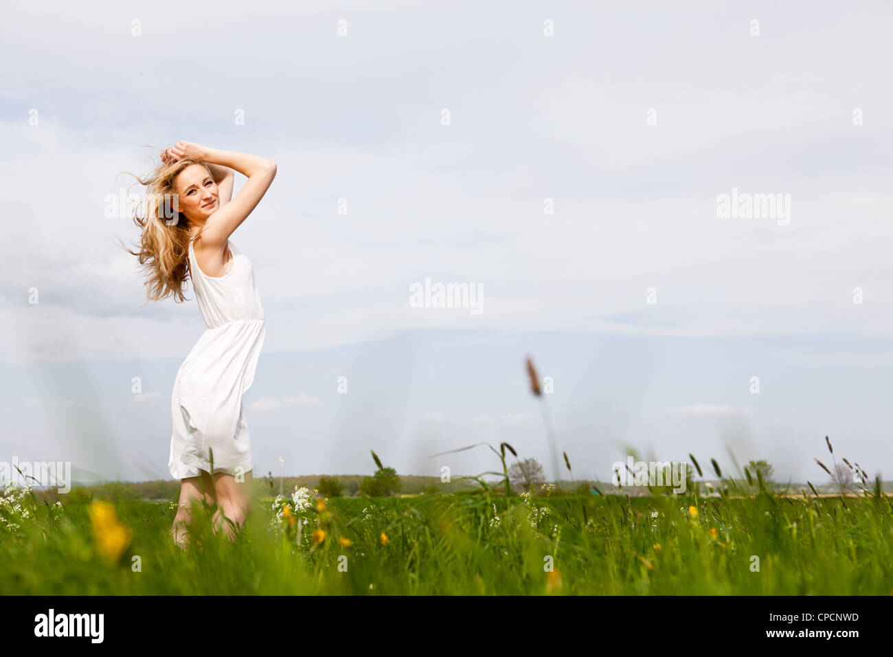 beautiful blonde woman outdoor in summer happy Stock Photo - Alamy