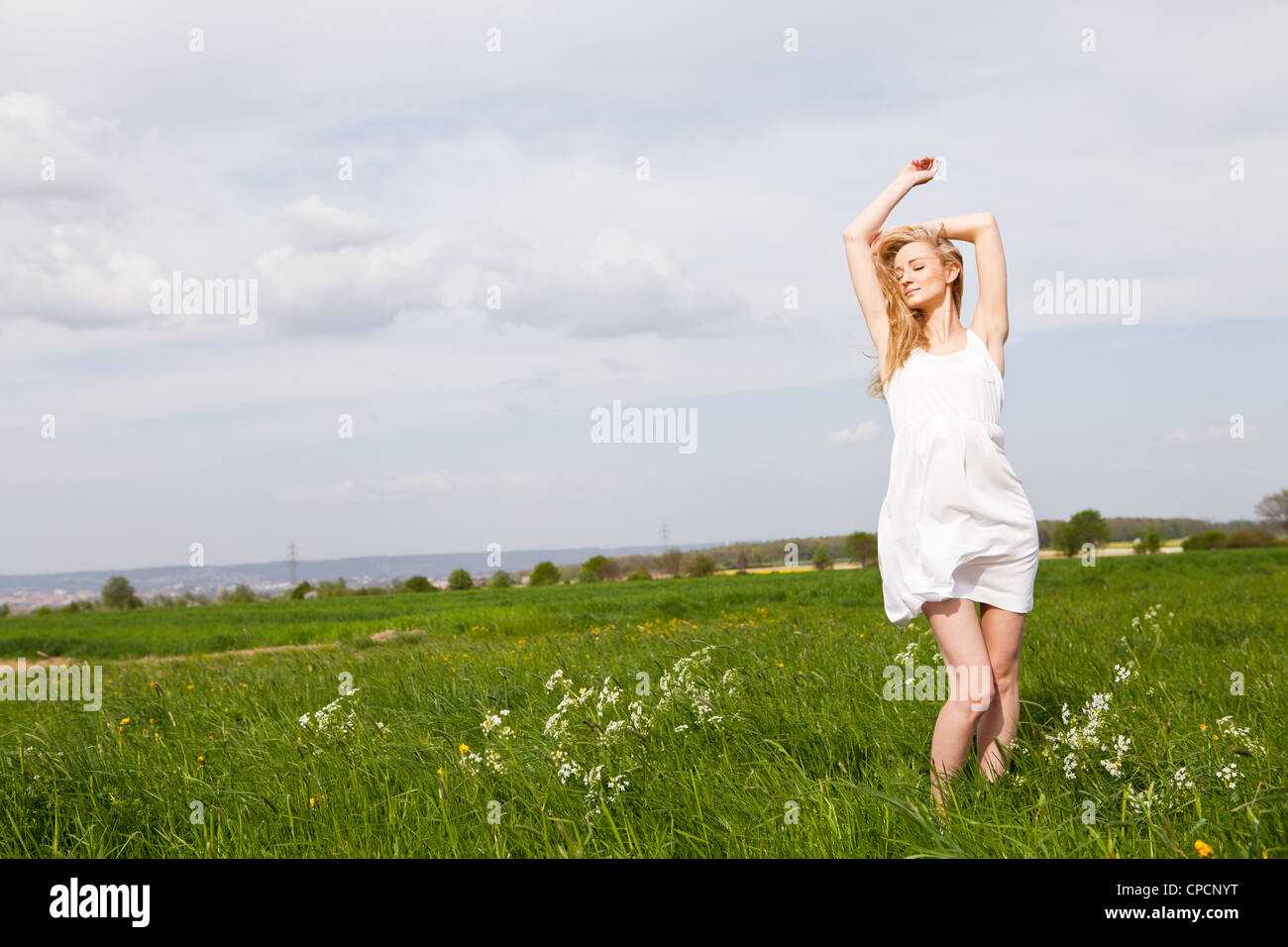 beautiful blonde woman outdoor in summer happy Stock Photo - Alamy