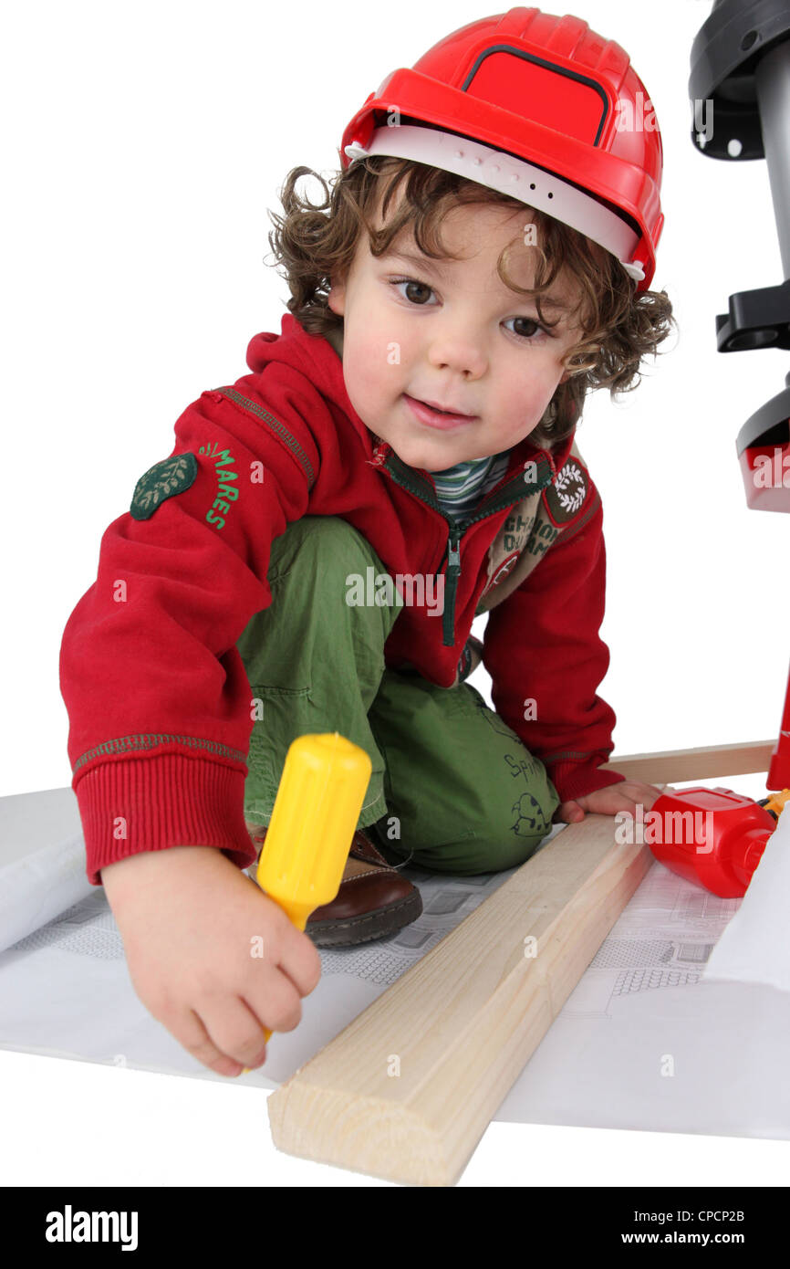 Little boy playing with a toy workshop Stock Photo - Alamy