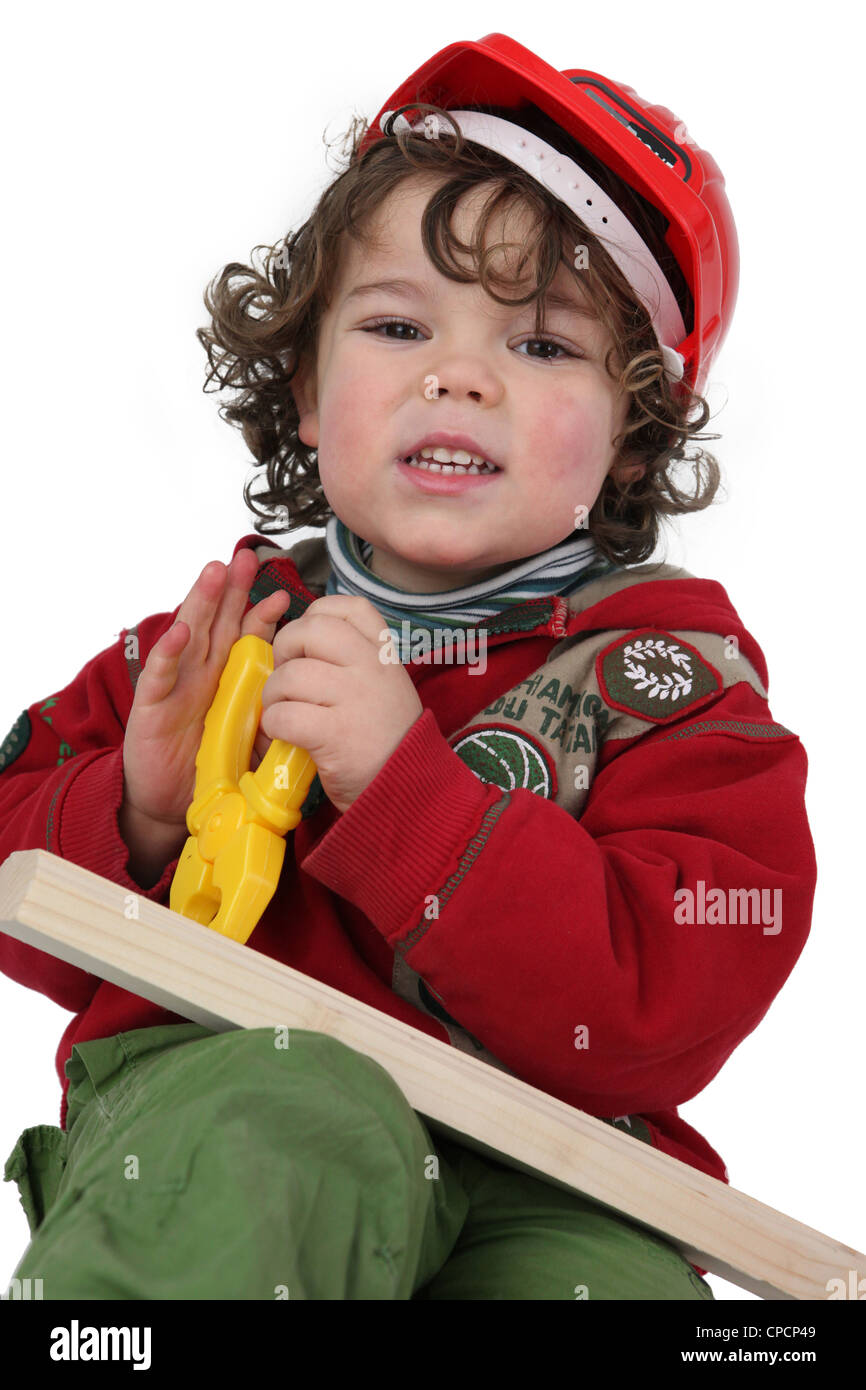 Little boy playing with toy tools Stock Photo - Alamy