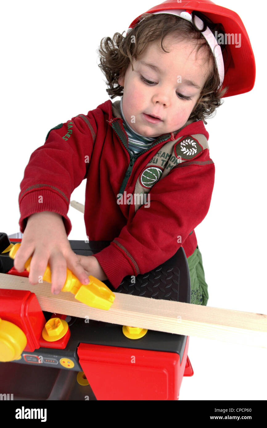 Little boy playing builder Stock Photo - Alamy