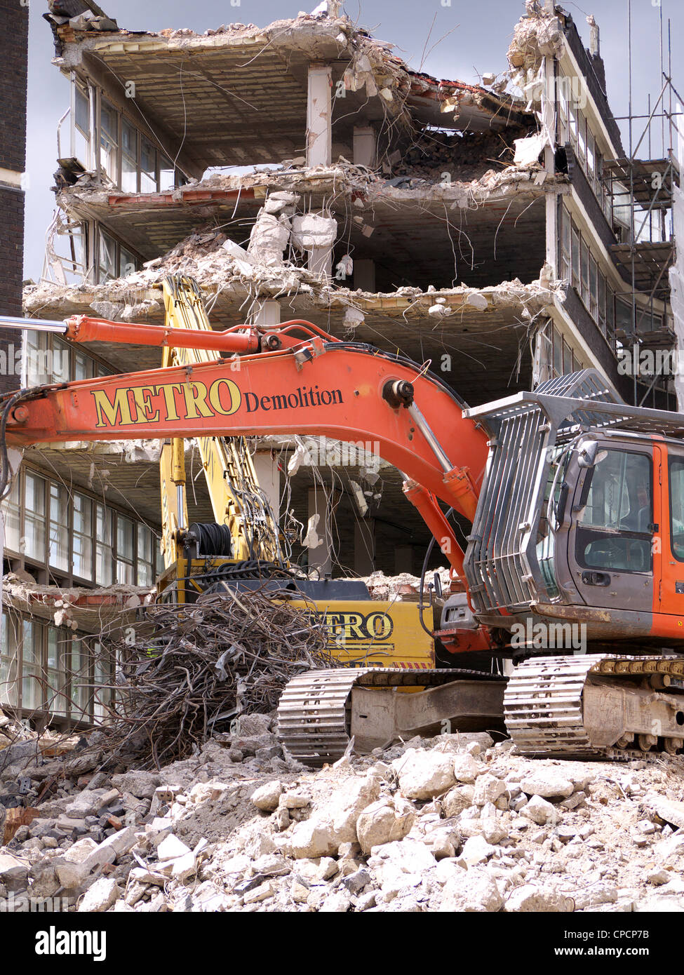 Excavators knocking down and old building in London UK Stock Photo - Alamy