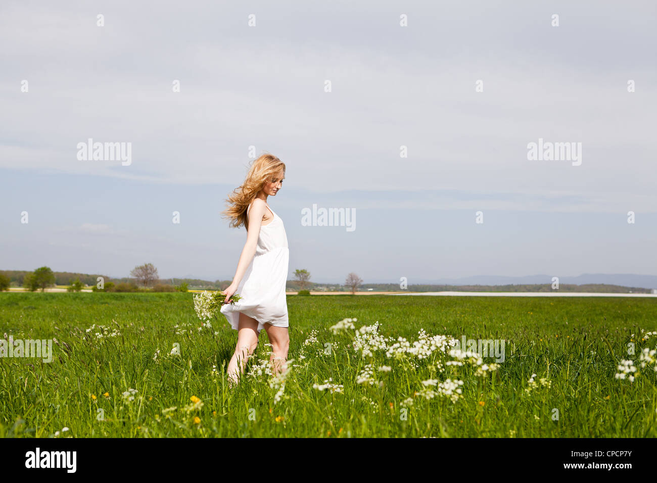 beautiful blonde woman outdoor in summer happy Stock Photo - Alamy