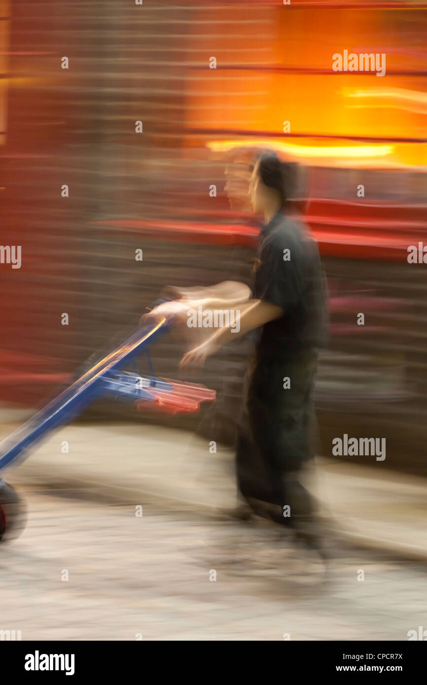 Market Porter & trolley running at night, Southbank, London, England ...