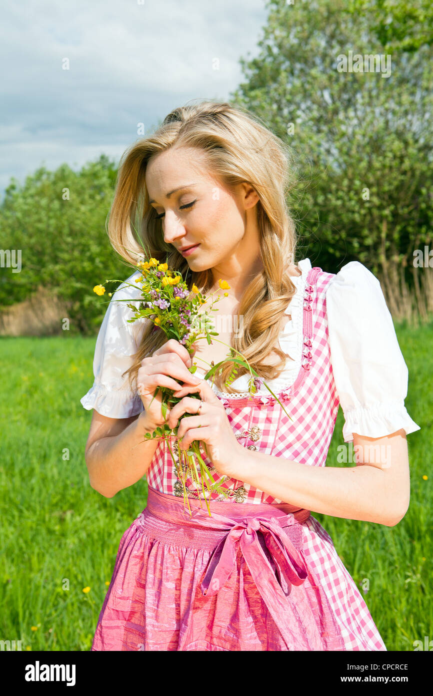young woman with pink dirndl outdoor in summer Stock Photo - Alamy