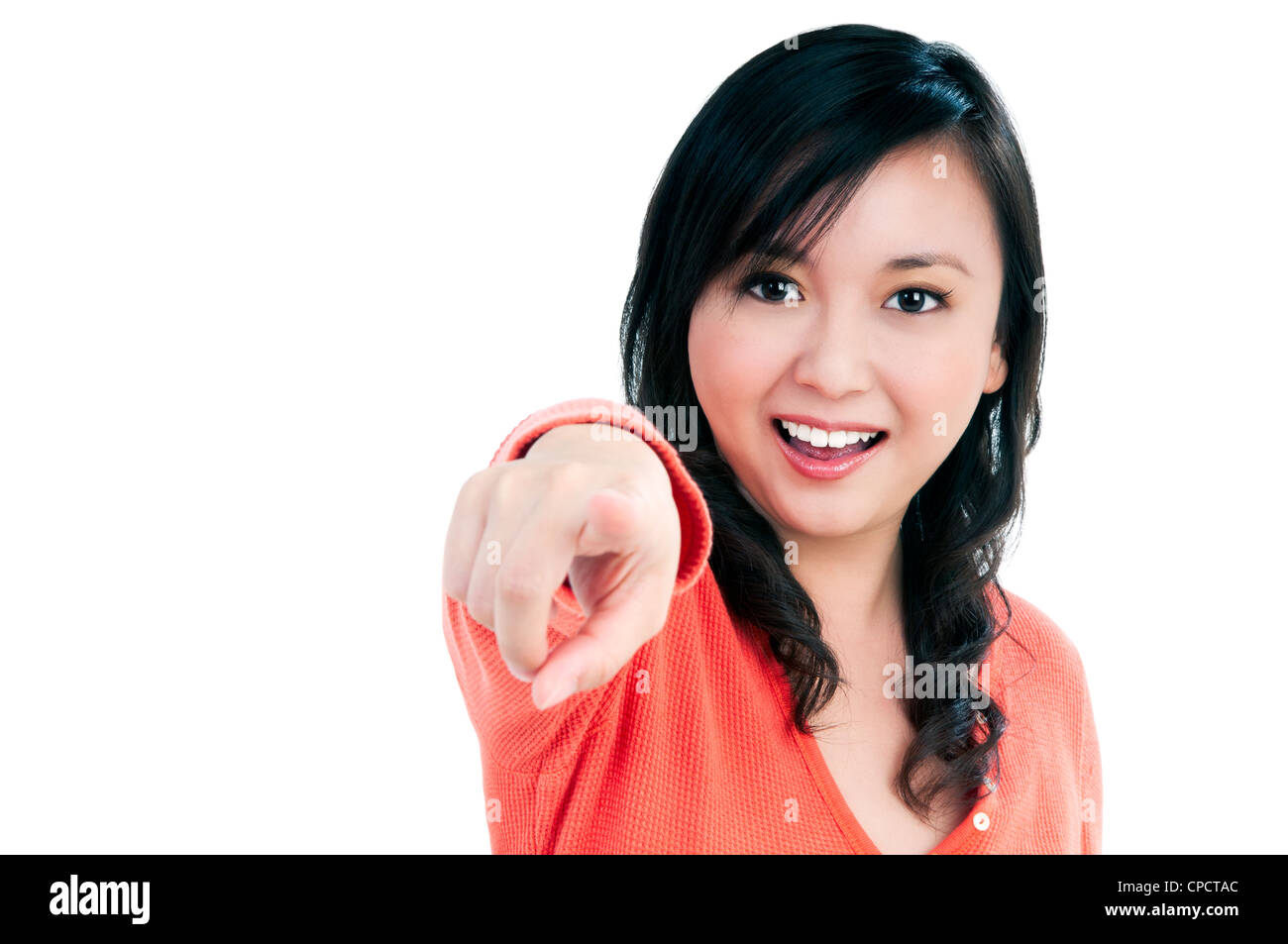 Happy young woman pointing Stock Photo - Alamy