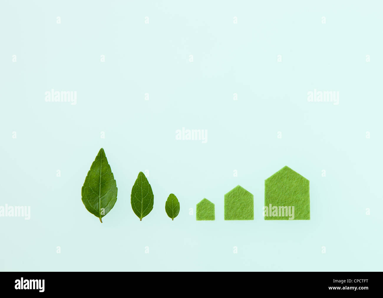 Eco houses and leaves Stock Photo - Alamy