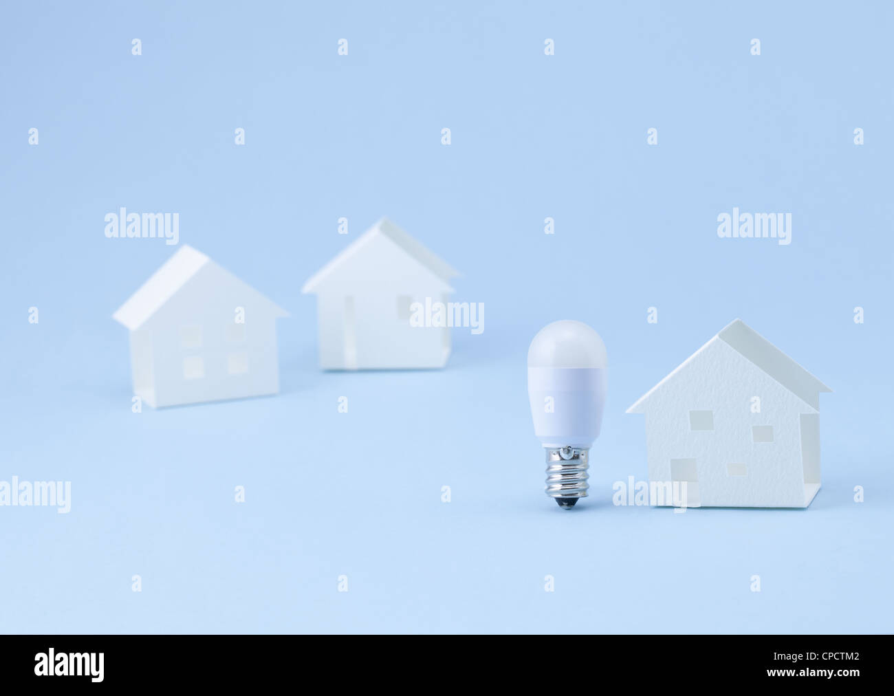 LED bulb and miniature houses Stock Photo - Alamy