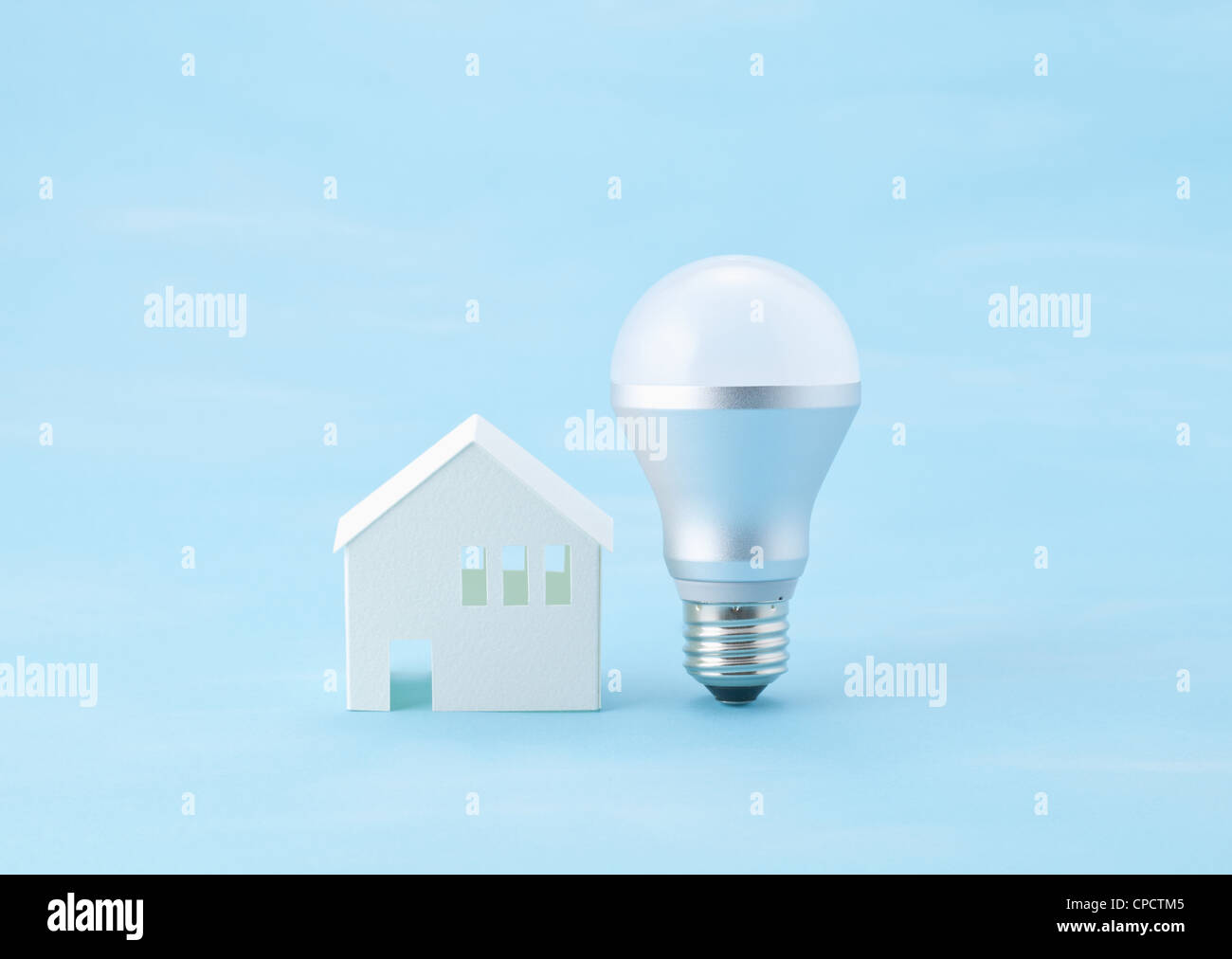 LED bulb and miniature house Stock Photo - Alamy