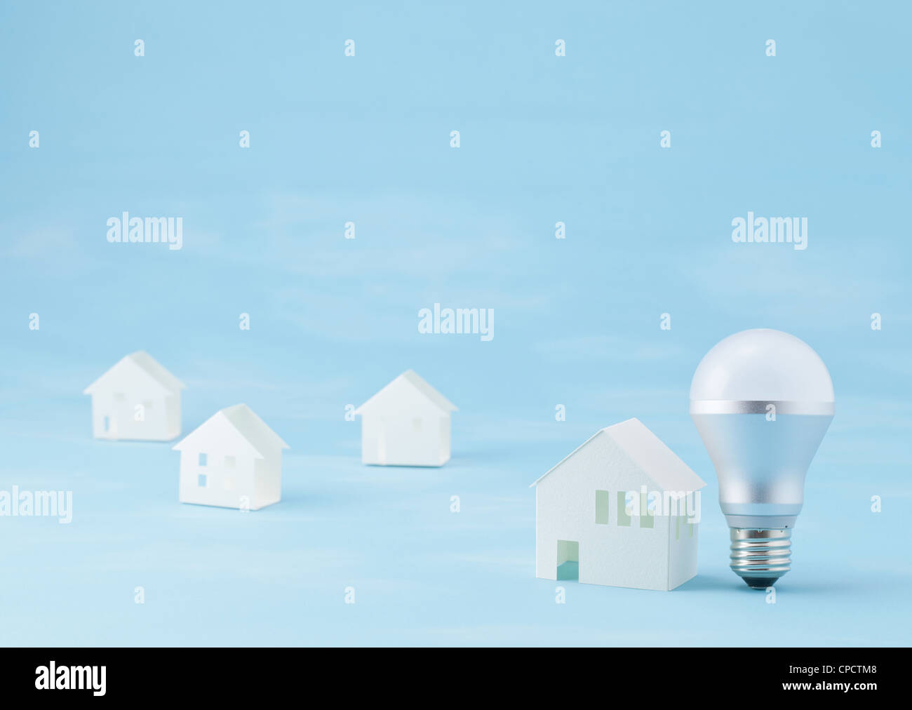 LED bulb and miniature houses Stock Photo - Alamy
