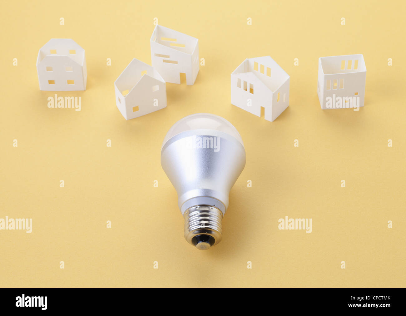 LED bulb and miniature houses Stock Photo - Alamy