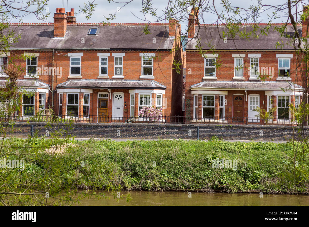 river with houses on a bank Stock Photo - Alamy