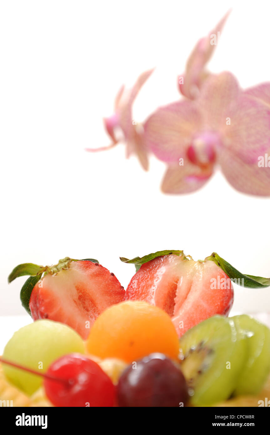 Fruit tart and Orchid Stock Photo - Alamy