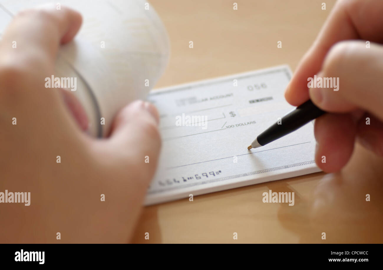 Prepare writing a check Stock Photo - Alamy