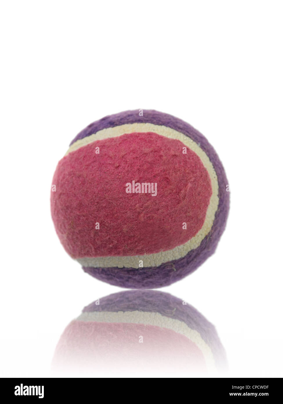 Sporting tennis balls on artificial green grass Stock Photo - Alamy