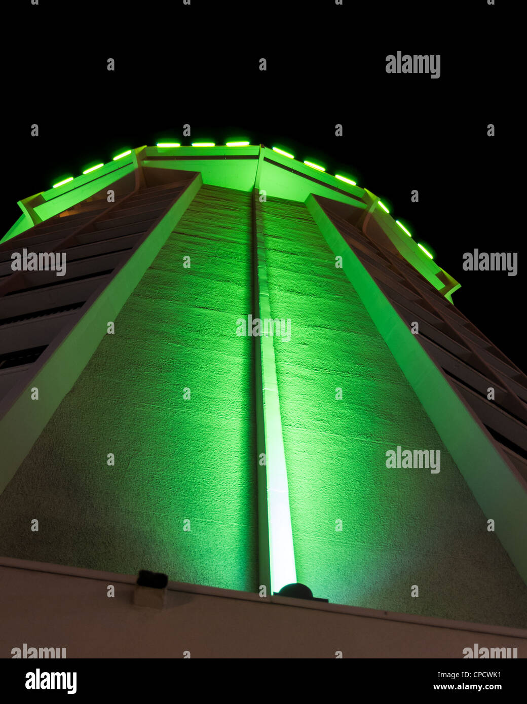 An apartment building lit by green spot lights Stock Photo - Alamy
