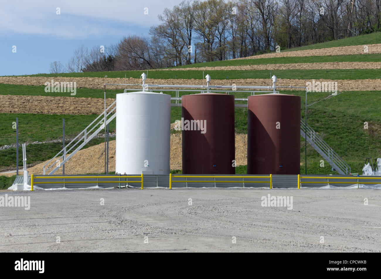 Storage tanks on a gas well drilling site Stock Photo - Alamy