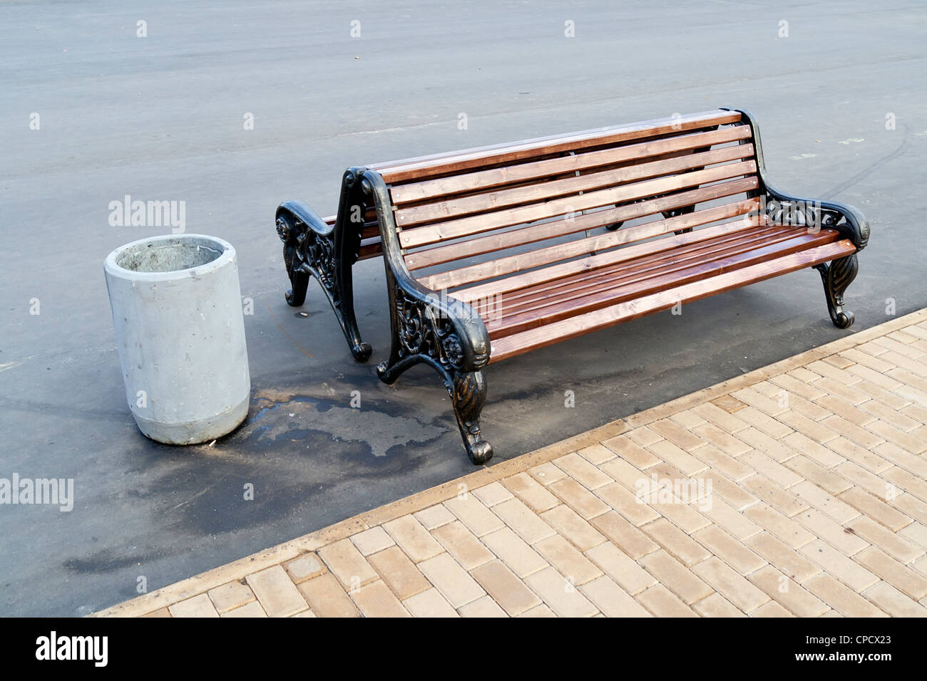 a bench to rest in a public city park Stock Photo - Alamy