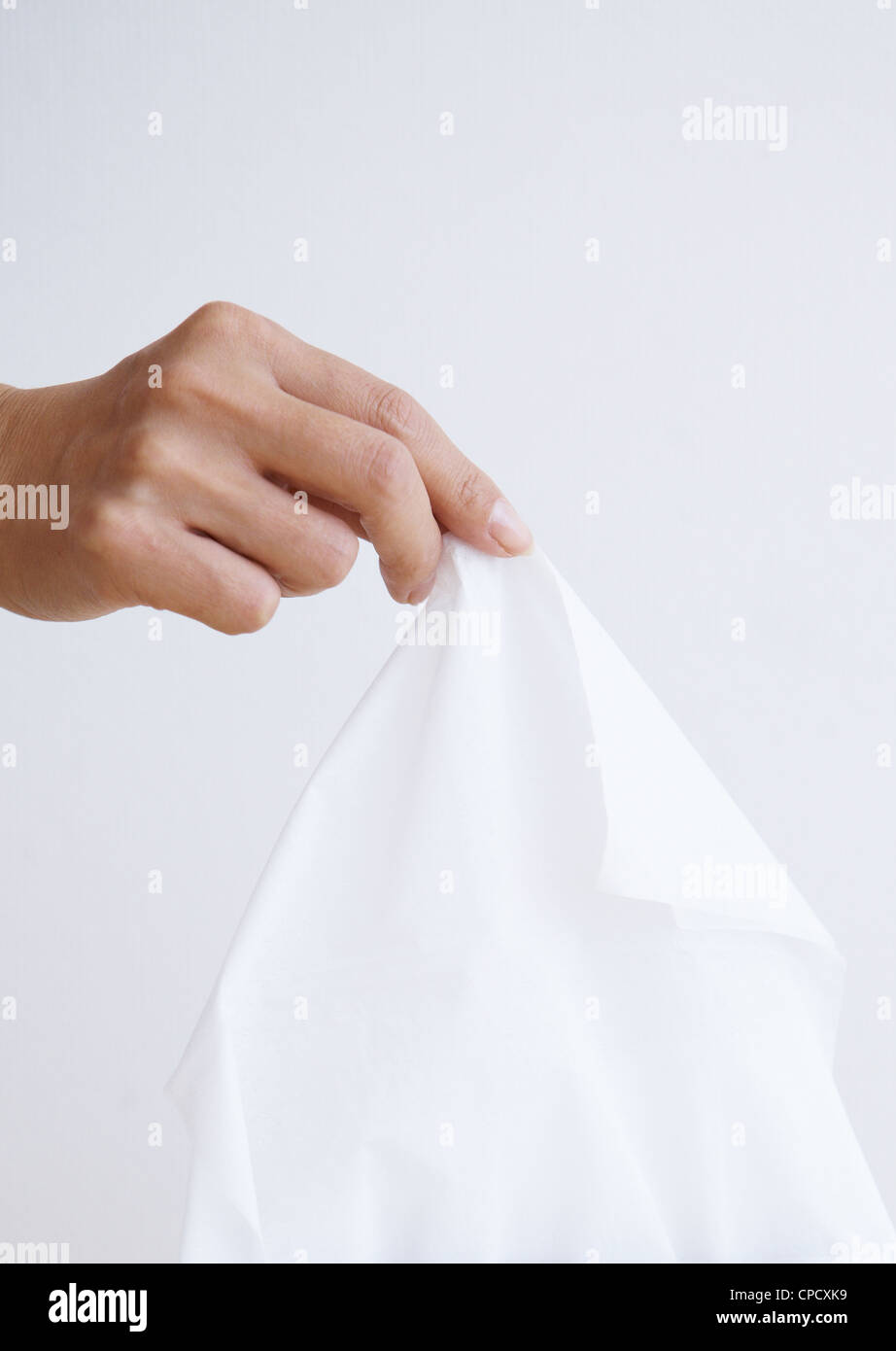 Hand taking tissue Stock Photo - Alamy