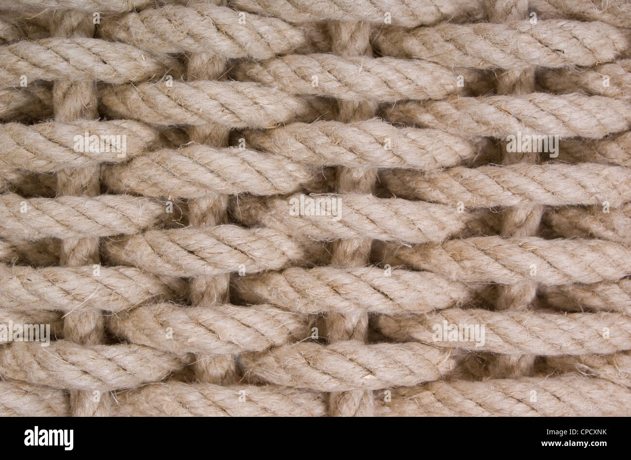 intertwine brown natural rope as background Stock Photo - Alamy