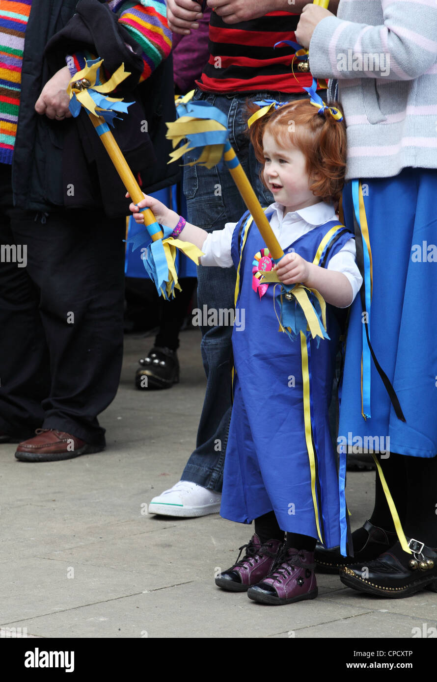 Young female child waving sticks with the Wakefield Morris Dancers ...