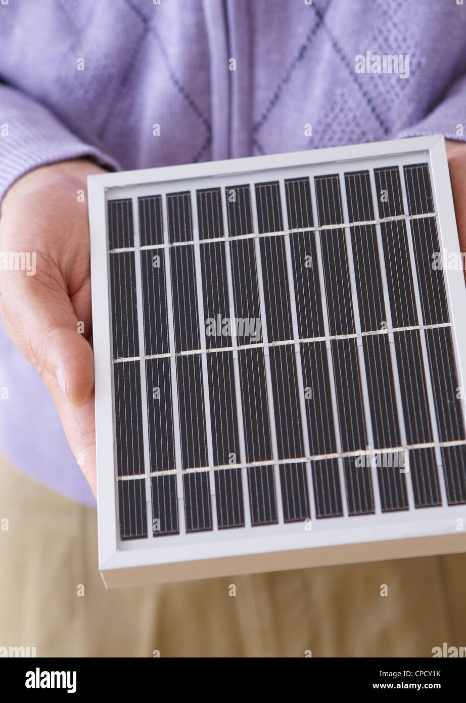 Man holding solar panel Stock Photo - Alamy