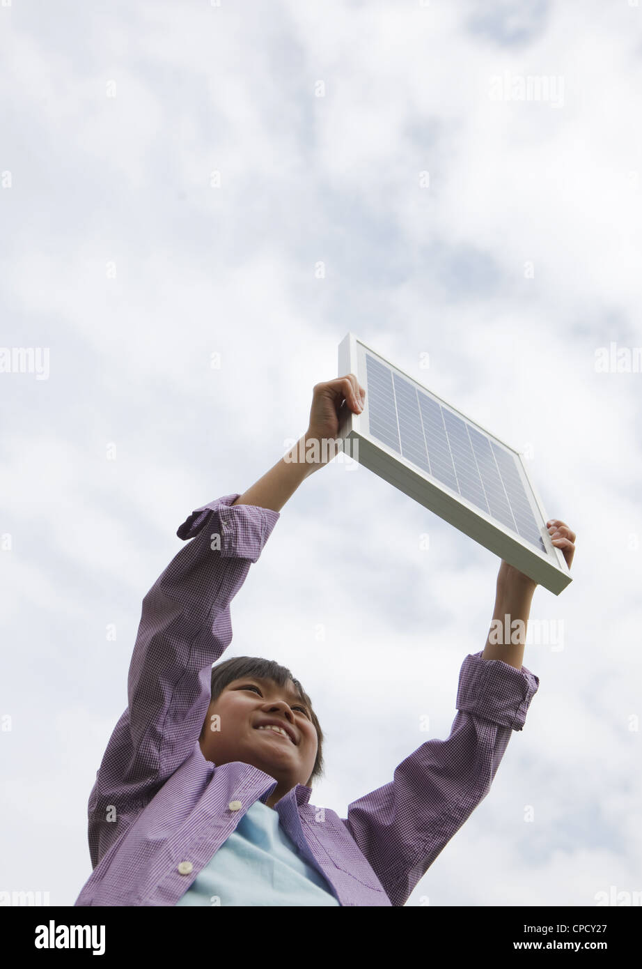 Boy holding solar panel Stock Photo - Alamy