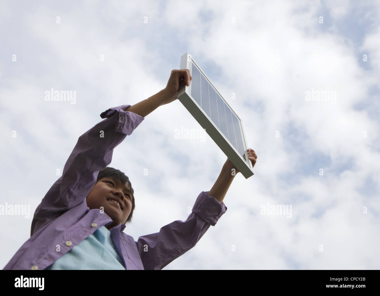 Boy holding solar panel Stock Photo - Alamy