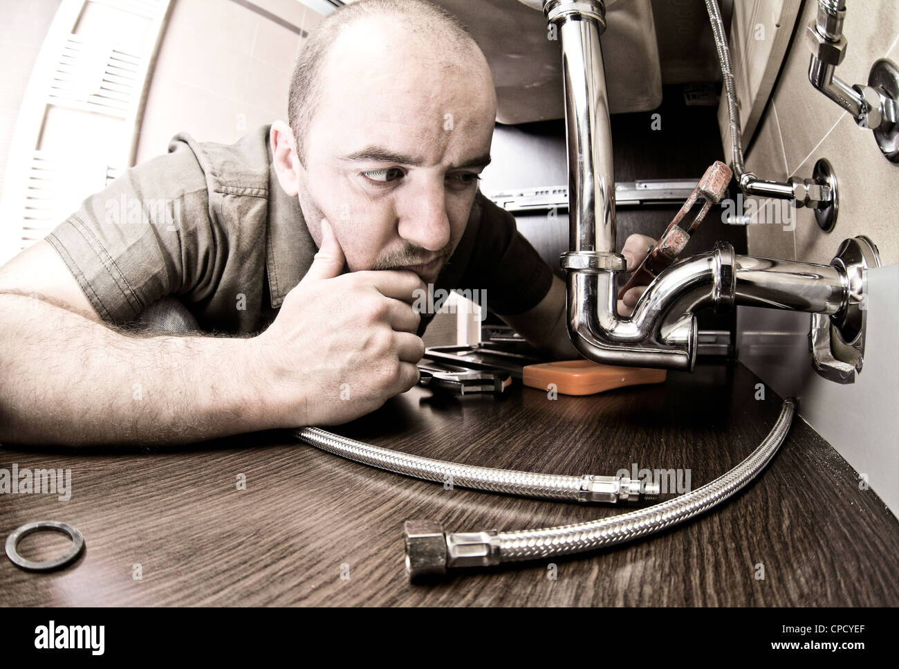 plumber thinking how to fix Stock Photo - Alamy