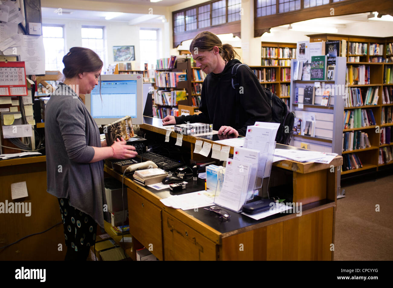 A librarian working The old Aberystwyth Carnegie funded public lending ...