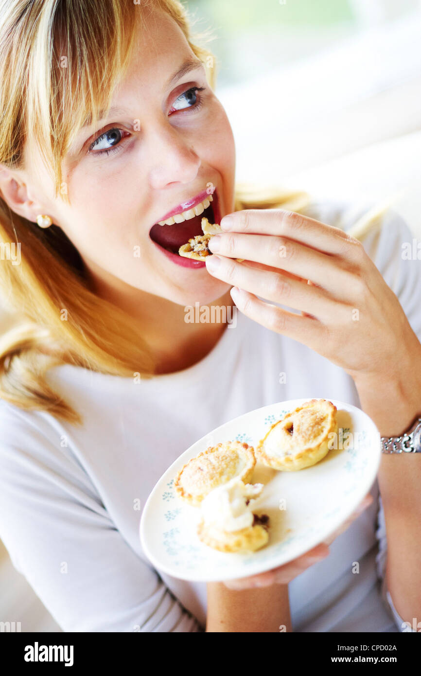 Woman Eating Mince Pies High Resolution Stock Photography and Images ...