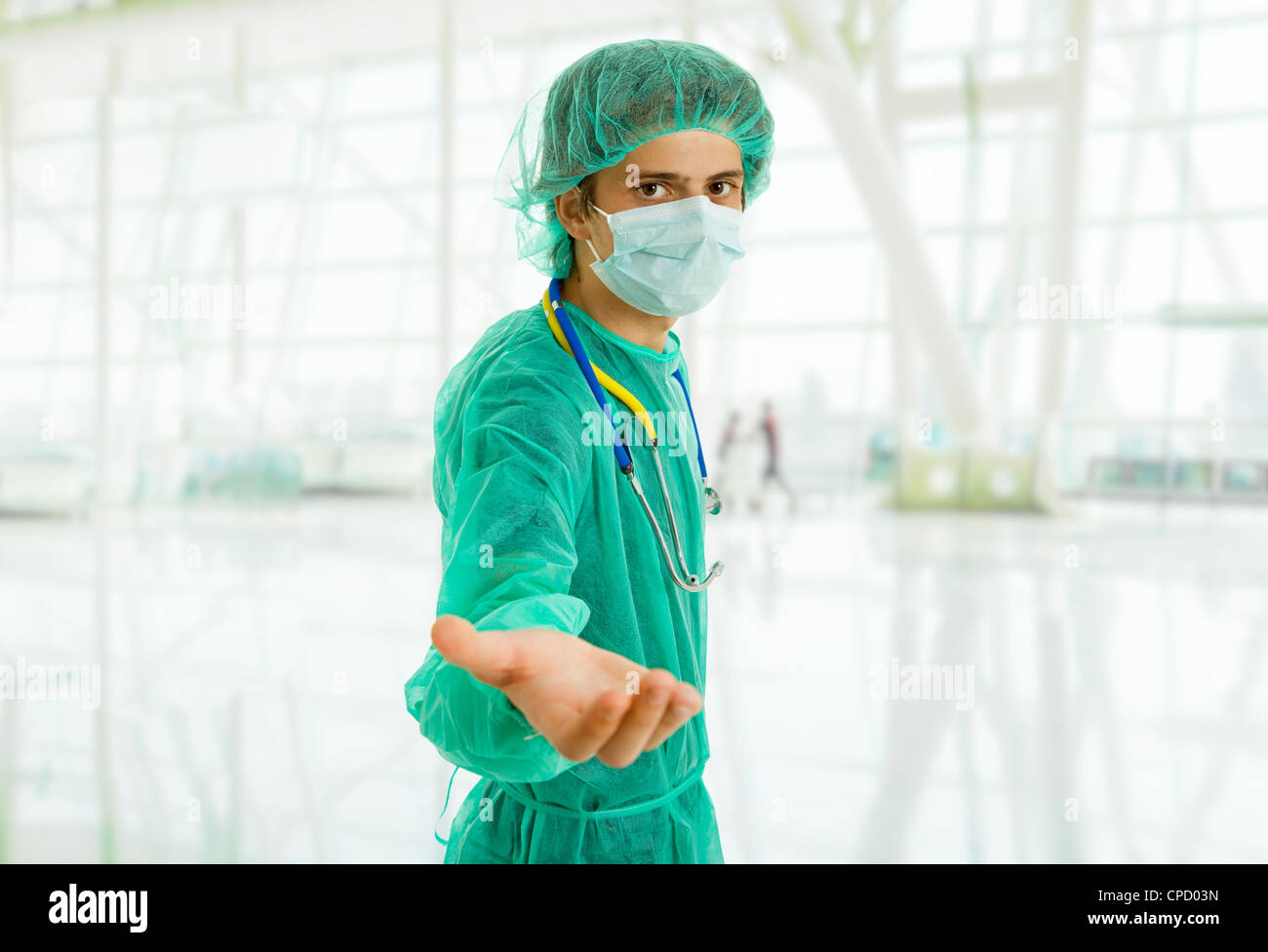 young male doctor offering hand, focus on the face Stock Photo - Alamy