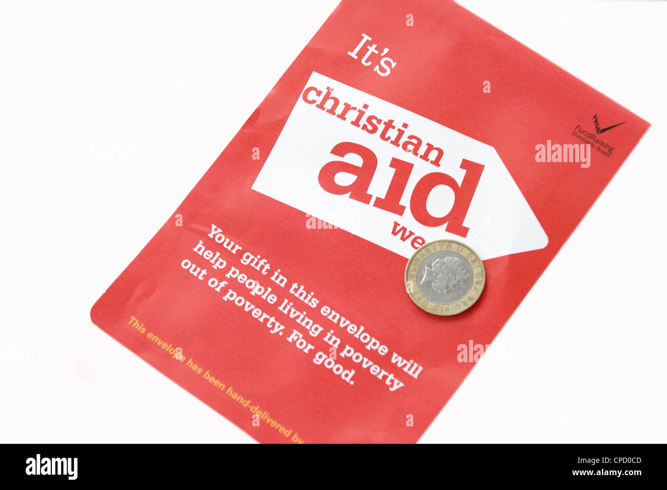 A donation of a £2 coin for a charity collecting envelope for Christian ...