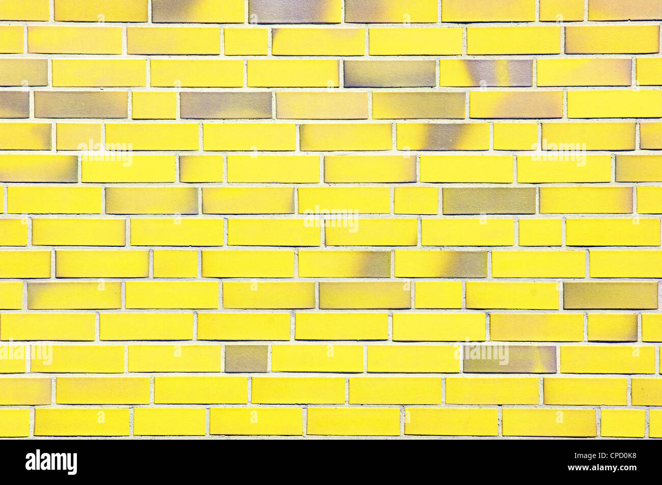 Wall with yellow bricks Stock Photo - Alamy