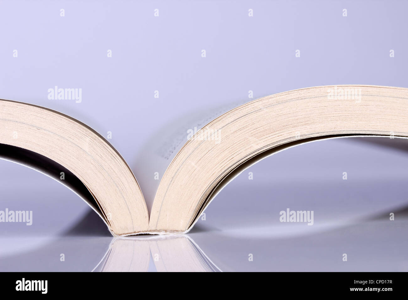 Open paperback book Stock Photo - Alamy