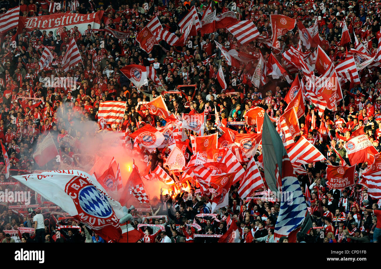 Supporters of FC Bayern Muenchen with flags, during the German Cup ...