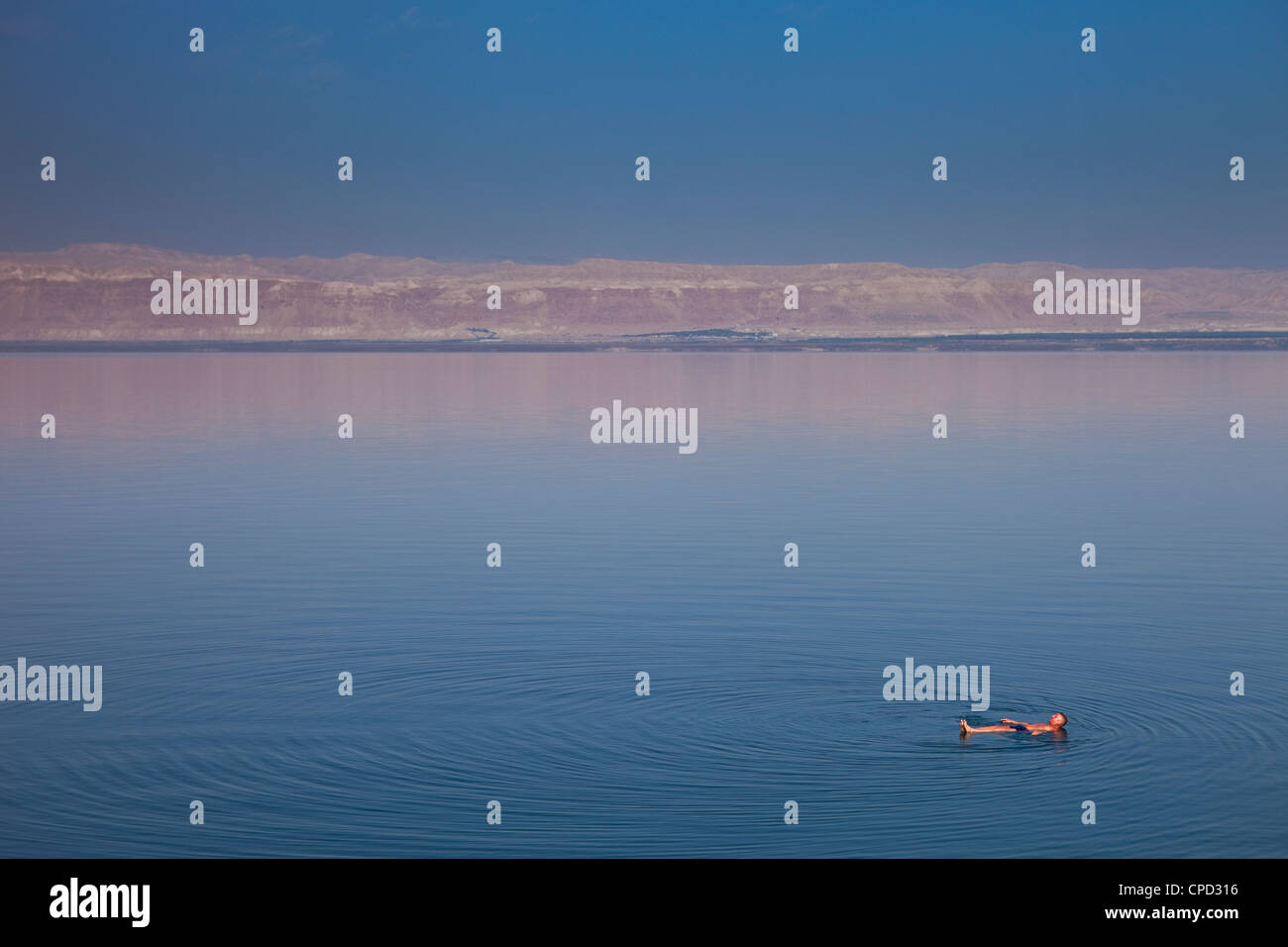 Young woman floating in the Dead Sea, Movenpick Resort Hotel, Jordan ...