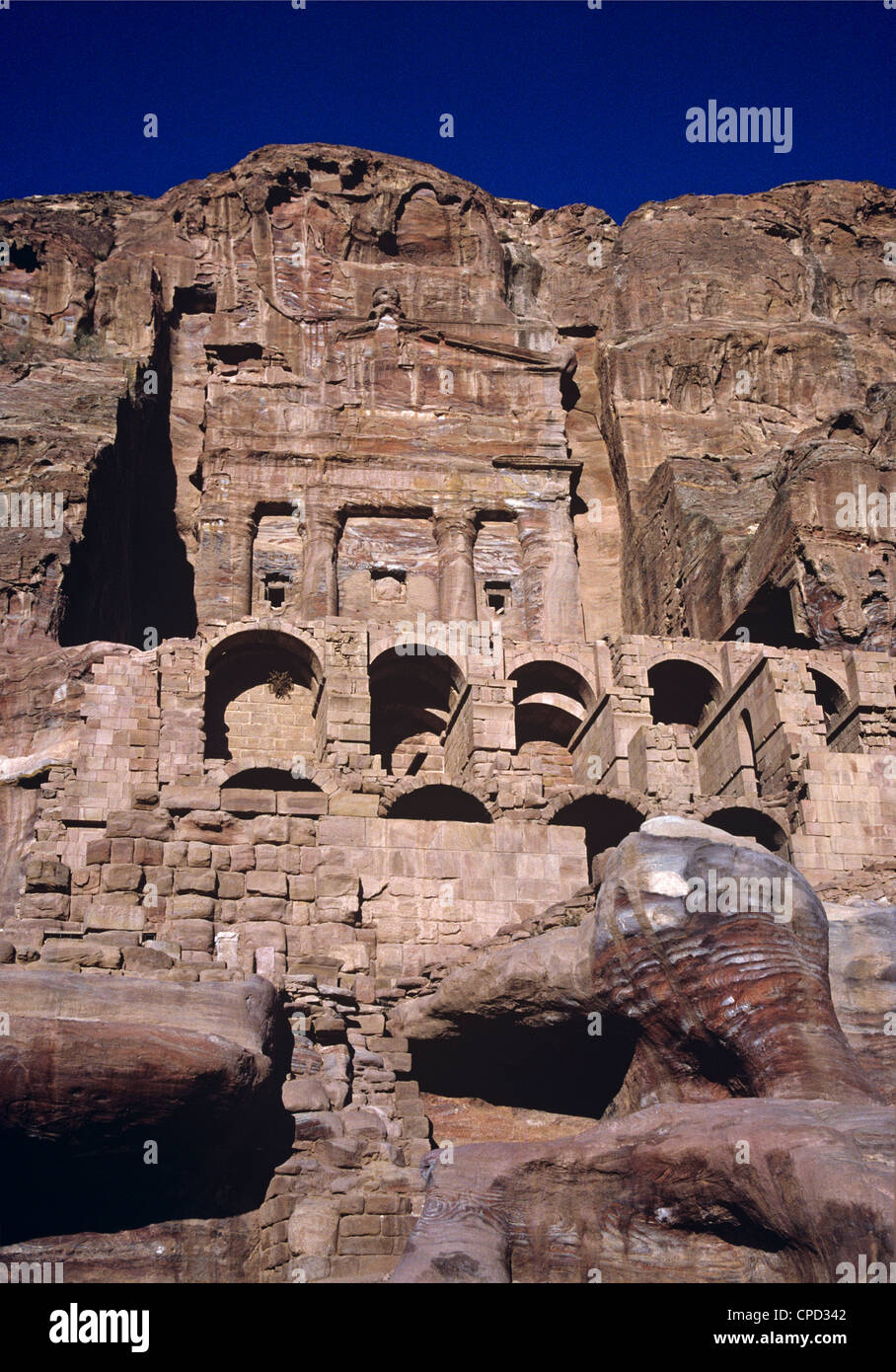 The Royal Urn Tomb carved out of the rock face in the ancient Nabataean ...