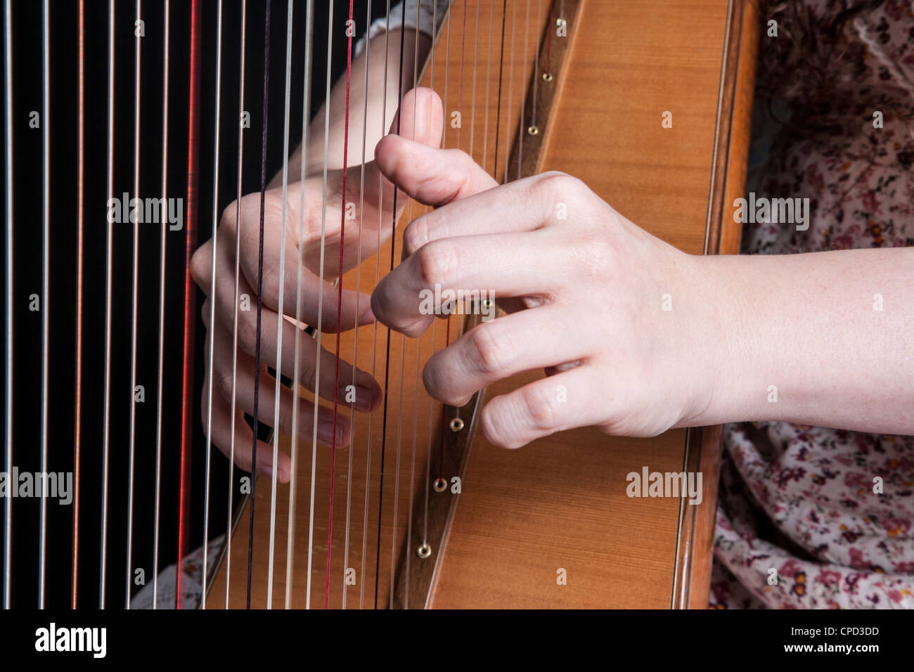 Irish woman playing harp Stock Photo - Alamy