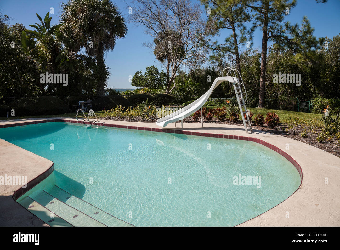 Swimming Pool with Slide, FL Stock Photo - Alamy