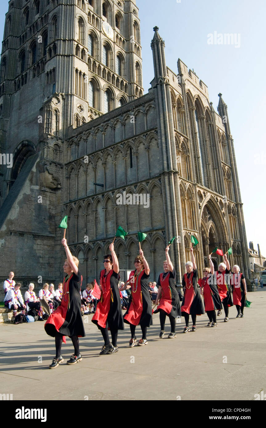 female morris dancers outside ely cathedral dancing Stock Photo - Alamy