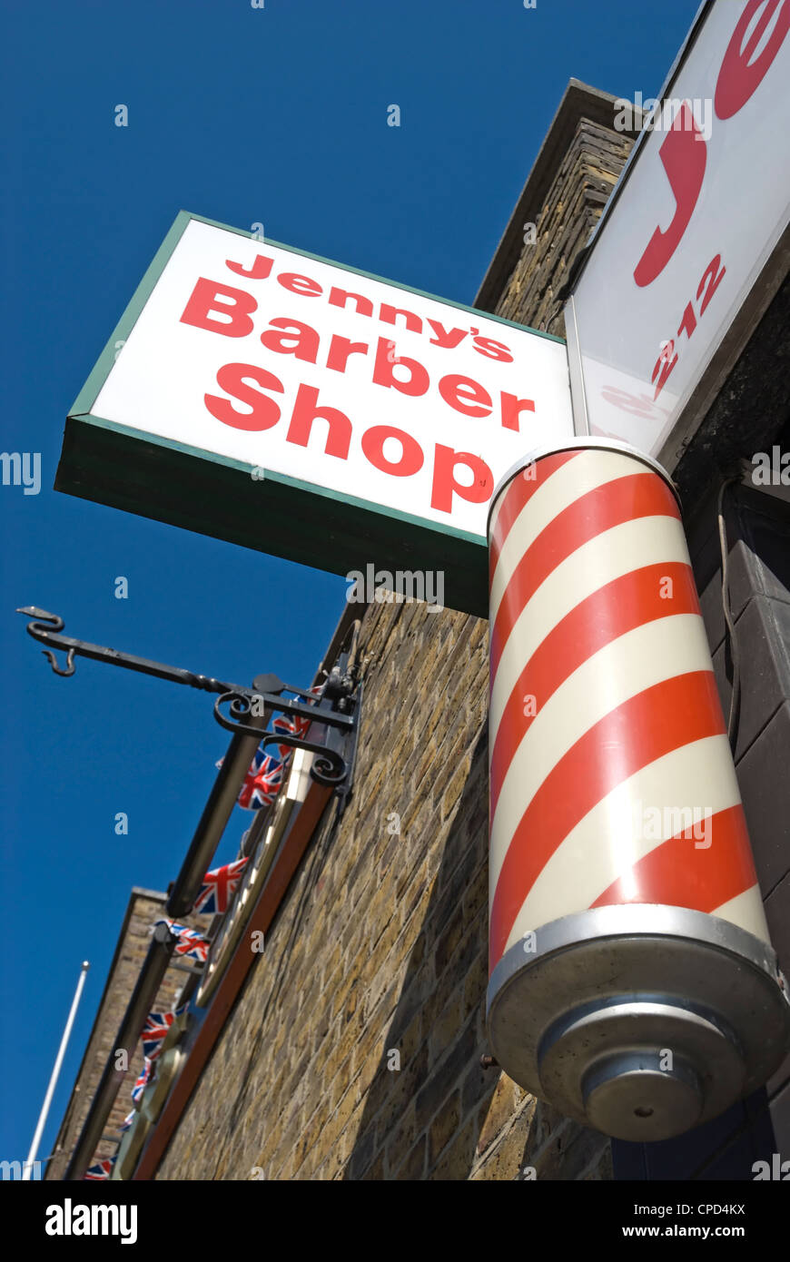 barber's shop sign with traditional red and white revolving pole, east ...