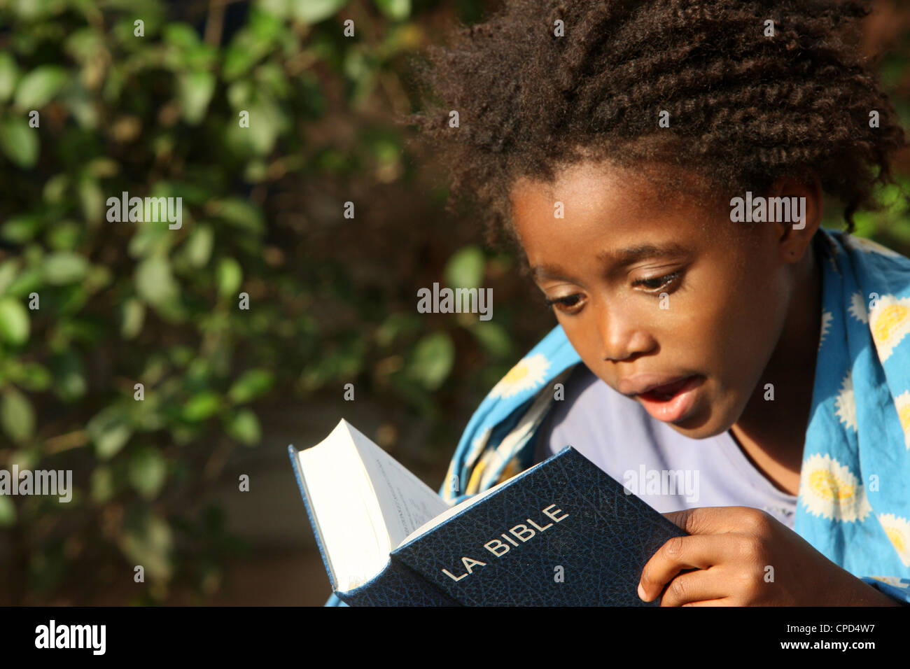 Woman Reading Bible To Child