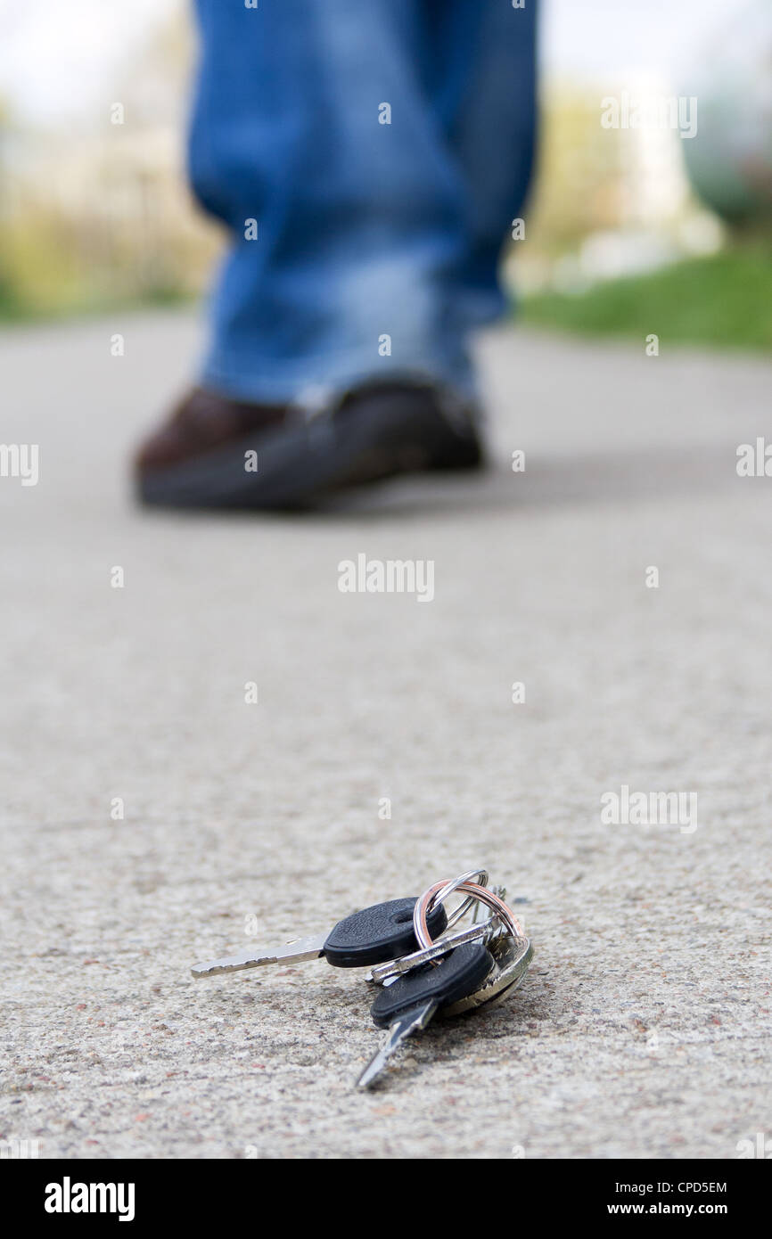 Lost keys are on the road. The legs stretching into the distance Stock ...