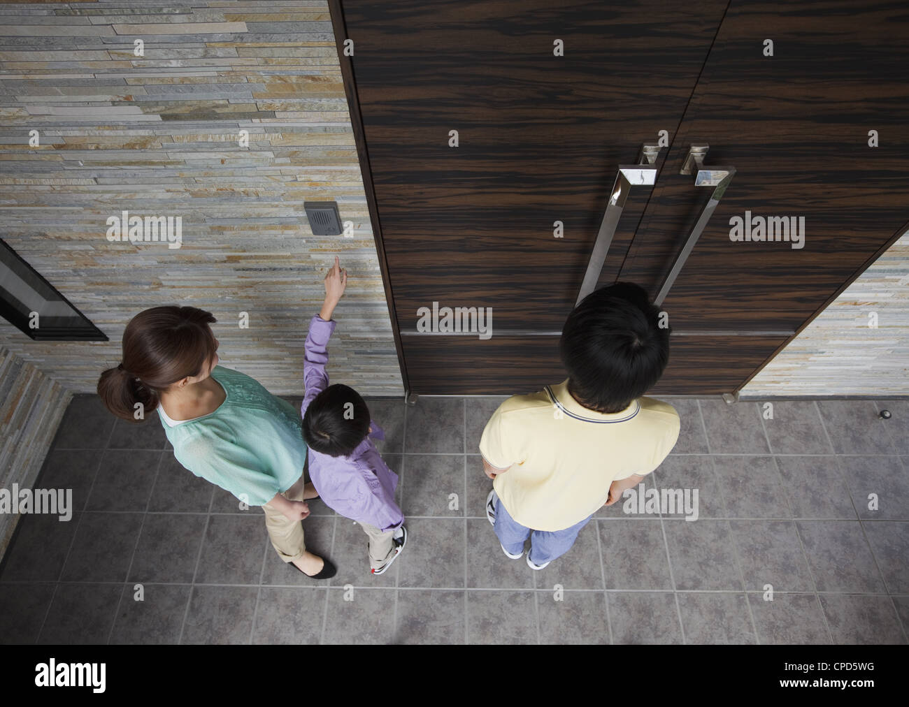 Family at front door Stock Photo - Alamy