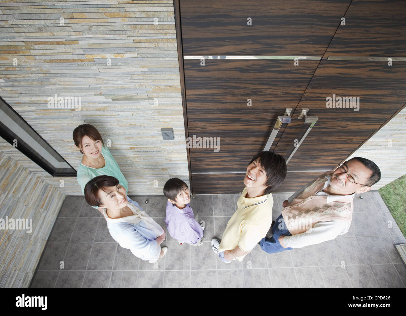 Family at front door Stock Photo - Alamy