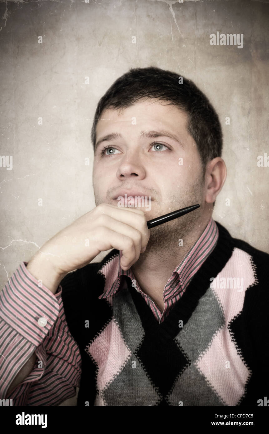Vintage portret of a young man thinking and looking up Stock Photo - Alamy