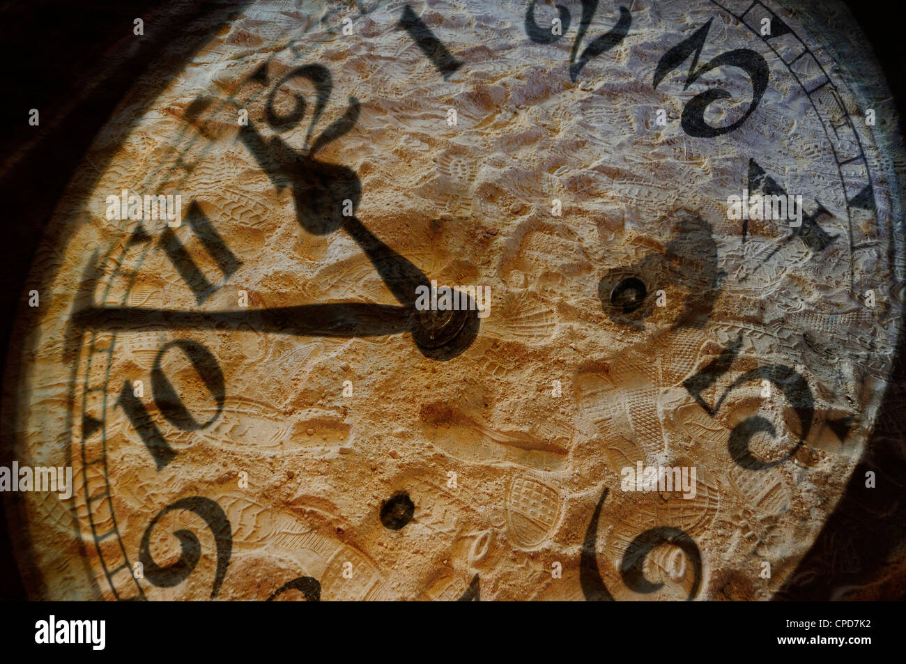 Mixed media image of vintage clock numbers over footsteps in the sand ...