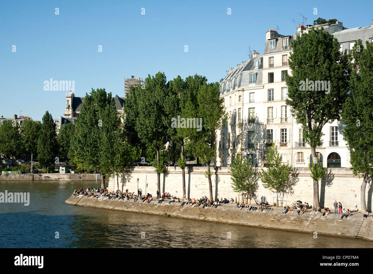Paris, France - People sunbathing on Ile St Louis Stock Photo - Alamy