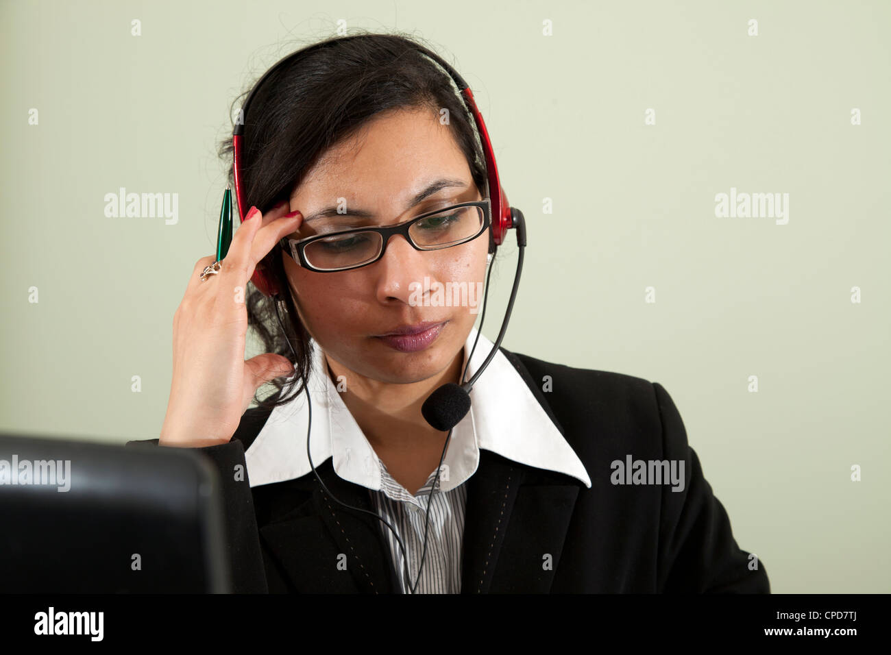 A female employee thinking on an issue Stock Photo - Alamy